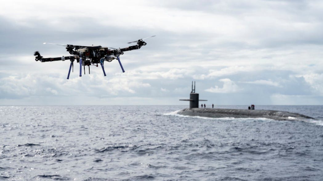 Unmanned aerial system delivers package to submarine at sea | Vision ...